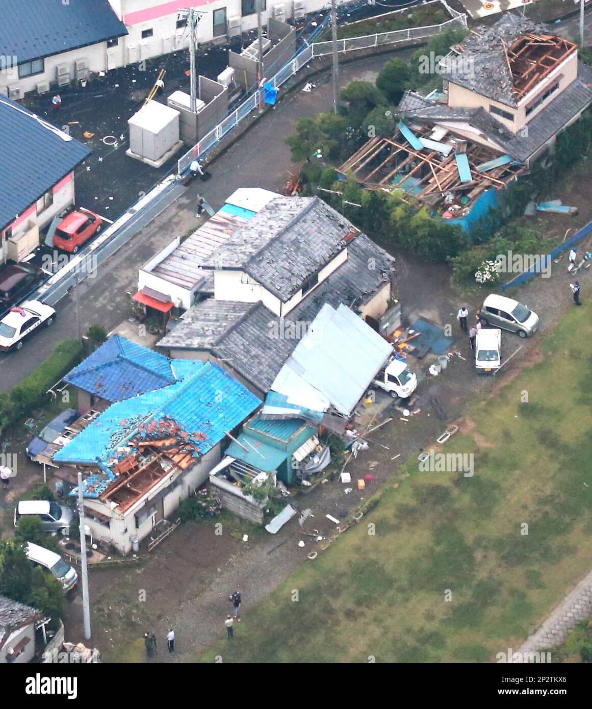 An aerial photo shows roofs of houses blown off and destroyed by a ...