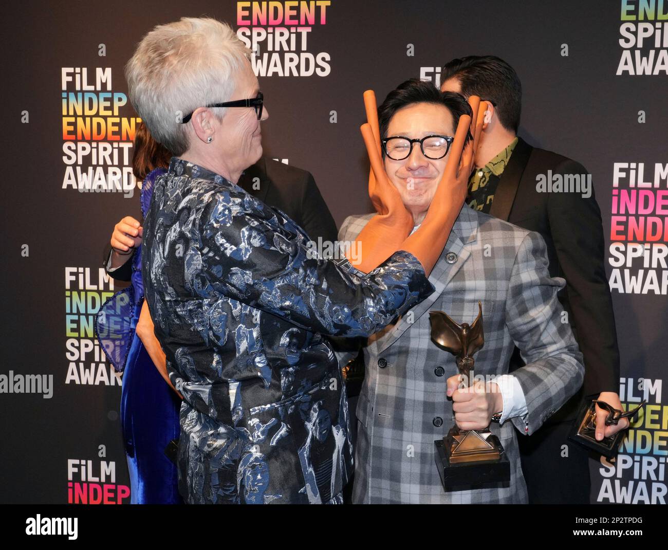 Jamie Lee Curtis, left, wearing hot dog fingers based on a prop from ...