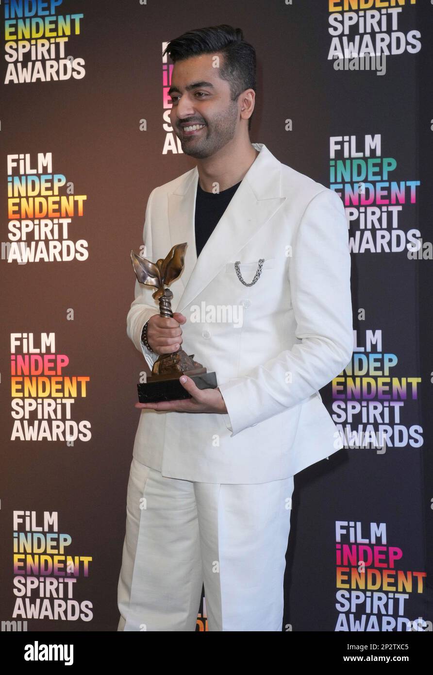 Saim Sadiq poses in the press room with the award for best ...