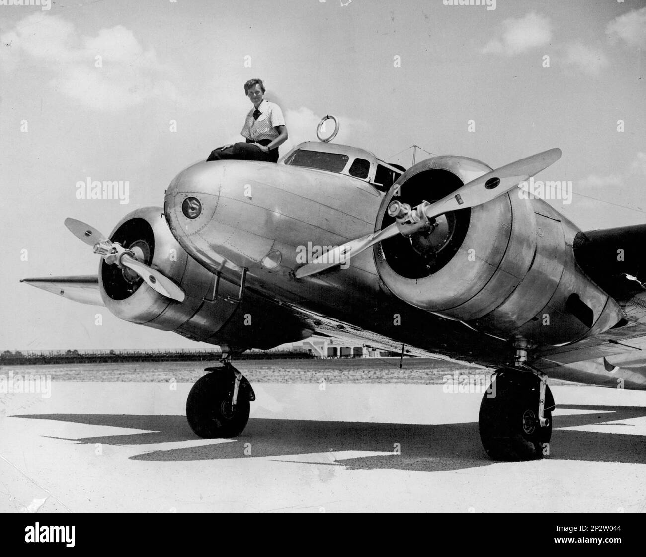 This 1937 photo shows Amelia Earhart before takeoff in Miami for an ...