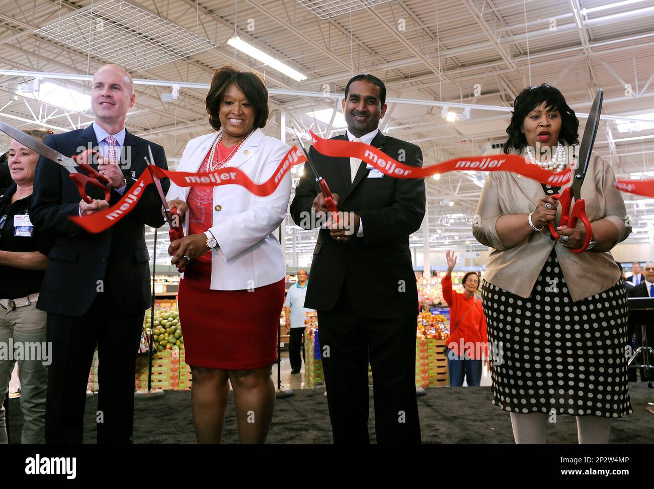 Left to right, J.K. Symancyk, President of Meijer, Sherry Gay Dagnogo ...