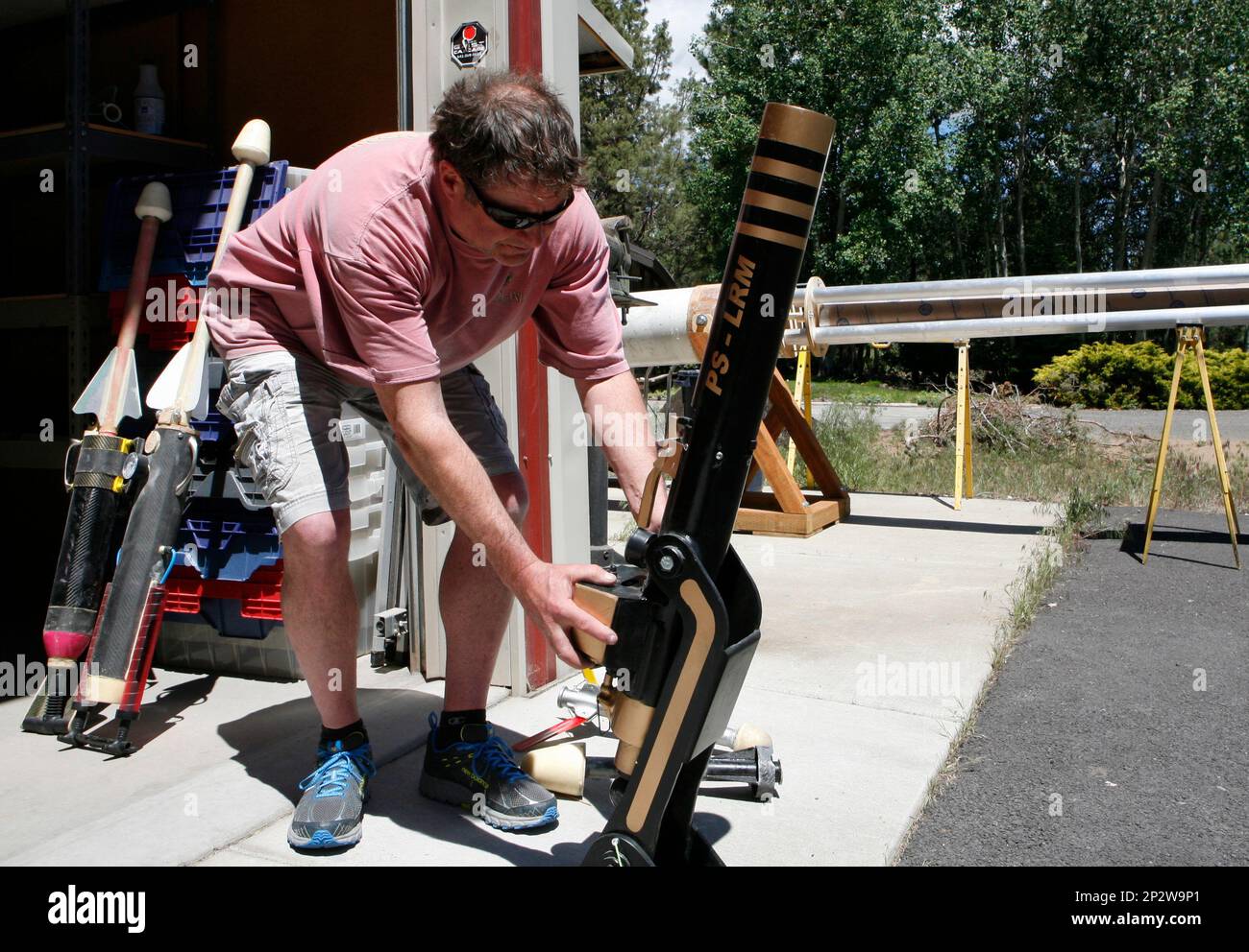 Brian Walker works with one of his inventions, an air powered rocket ...