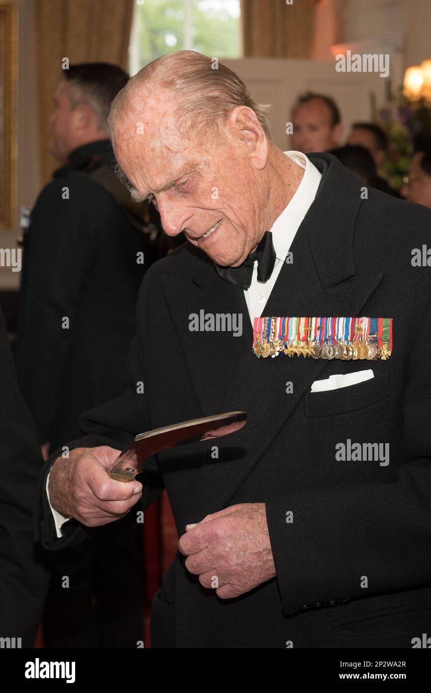 Britain's Prince Philip holds a Kukri, a traditional Gurkha weapon ...