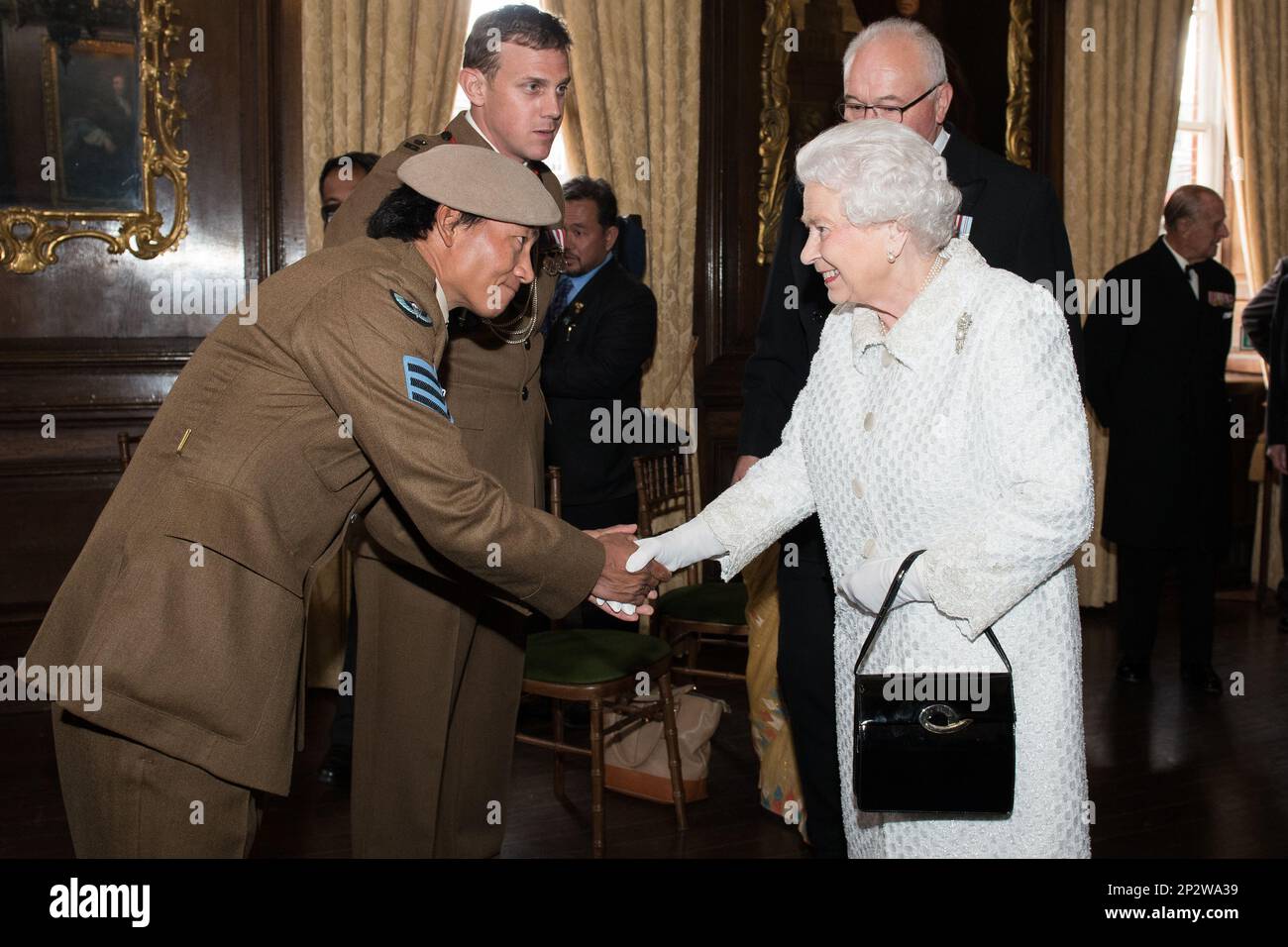 Britain's Queen Elizabeth II meets Sergeant Dhani Rai during the ... Britain's Queen Elizabeth II meets Sergeant Dhani Rai during the ...
