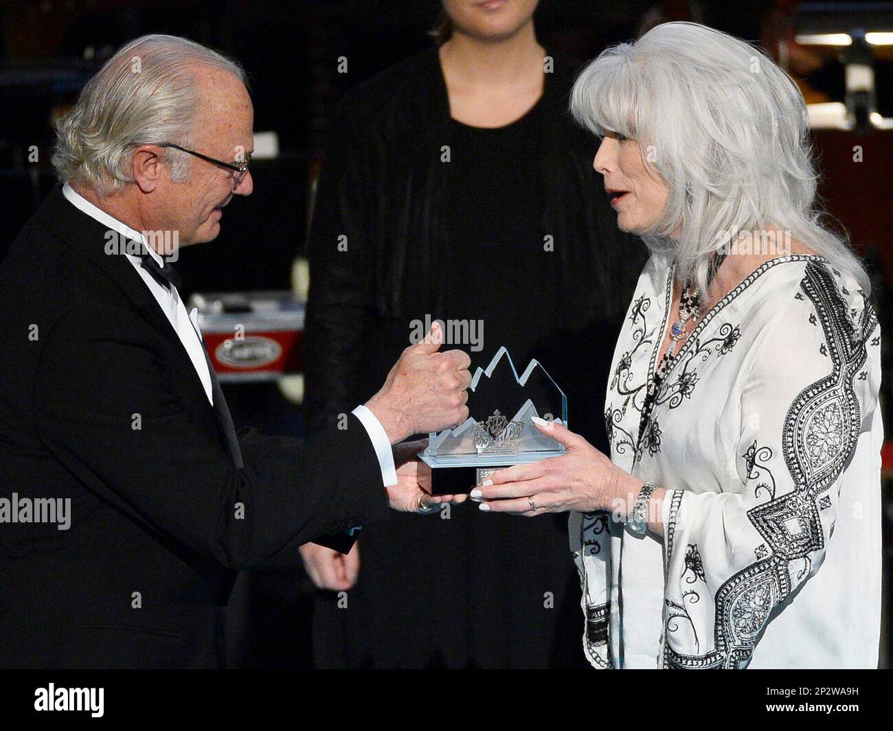 American singer and songwriter Emmylou Harris, right, receives the ...