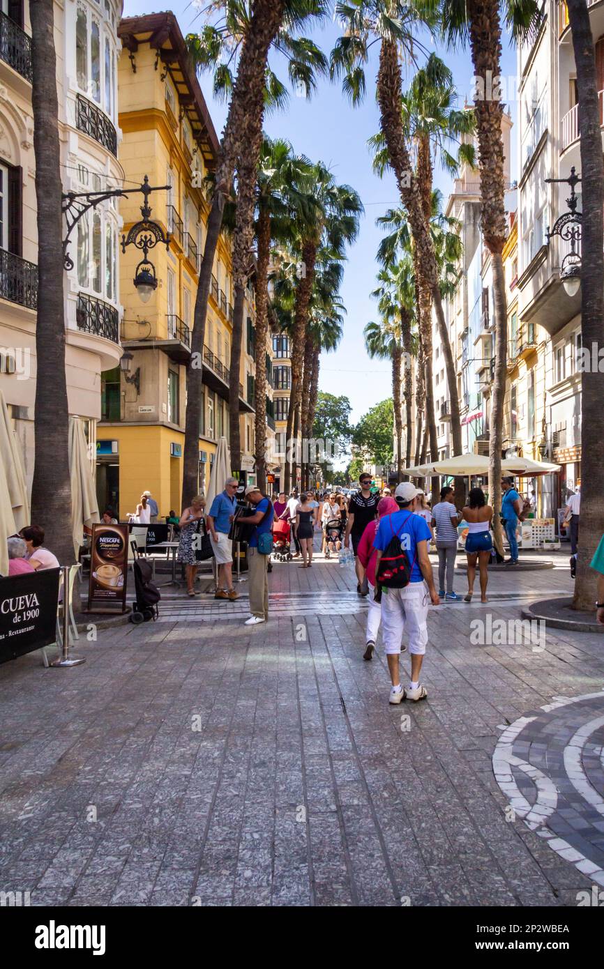 Malaga, Spain - June 18th 2018: Shoppers and tourists on a street in ...