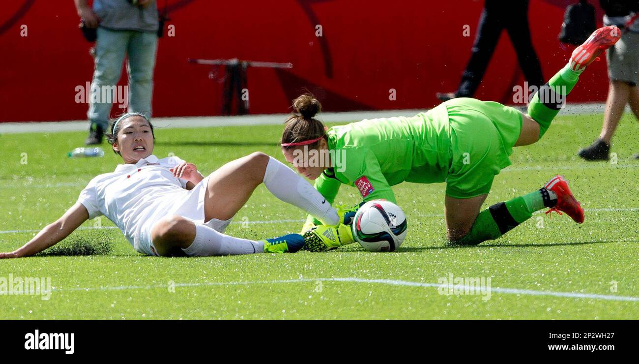 Canada's goalkeeper Erin McLeod (1) makes the save on China's Gu Yasha ...