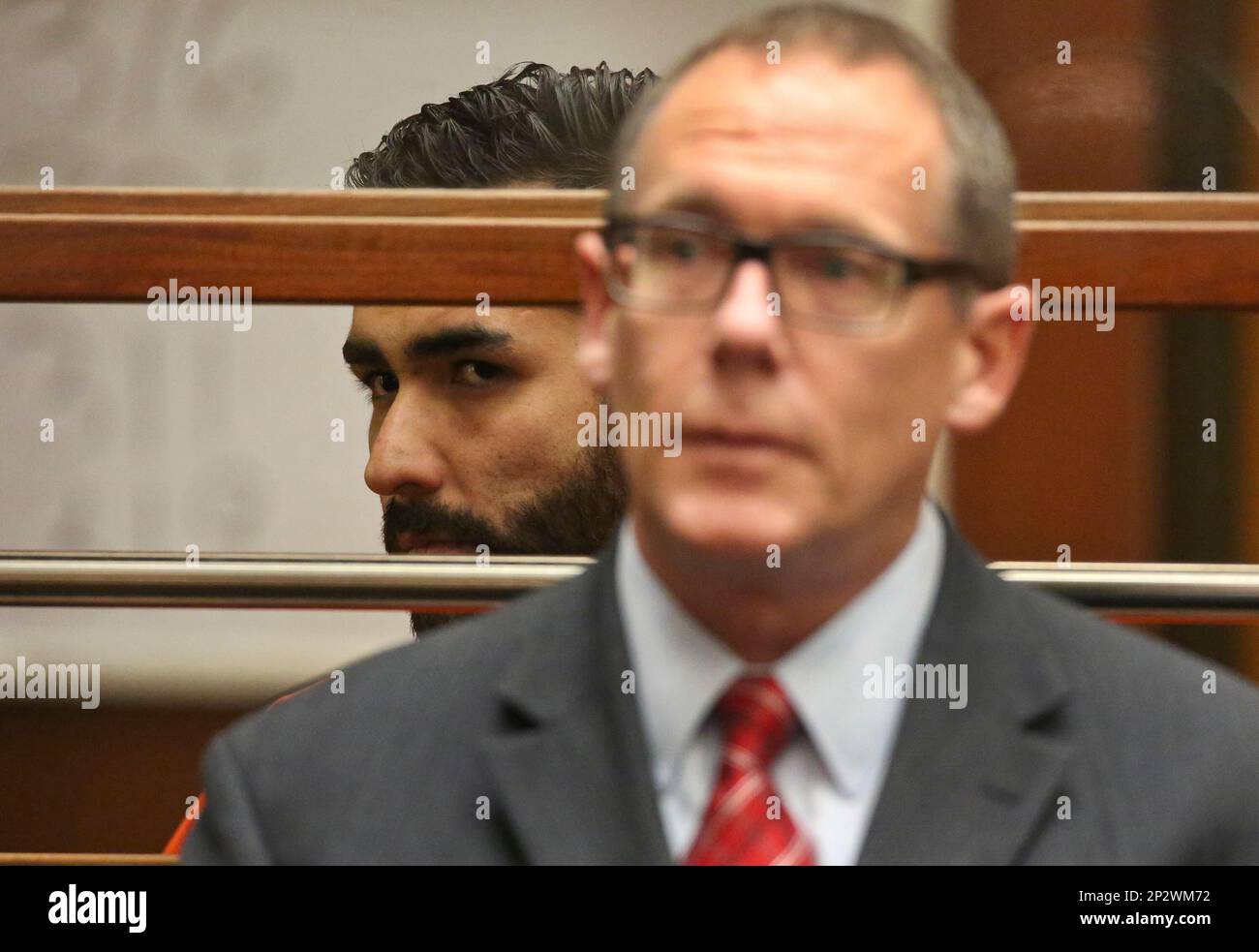 Henry Solis, a former Los Angeles police officer, left, appears with ...