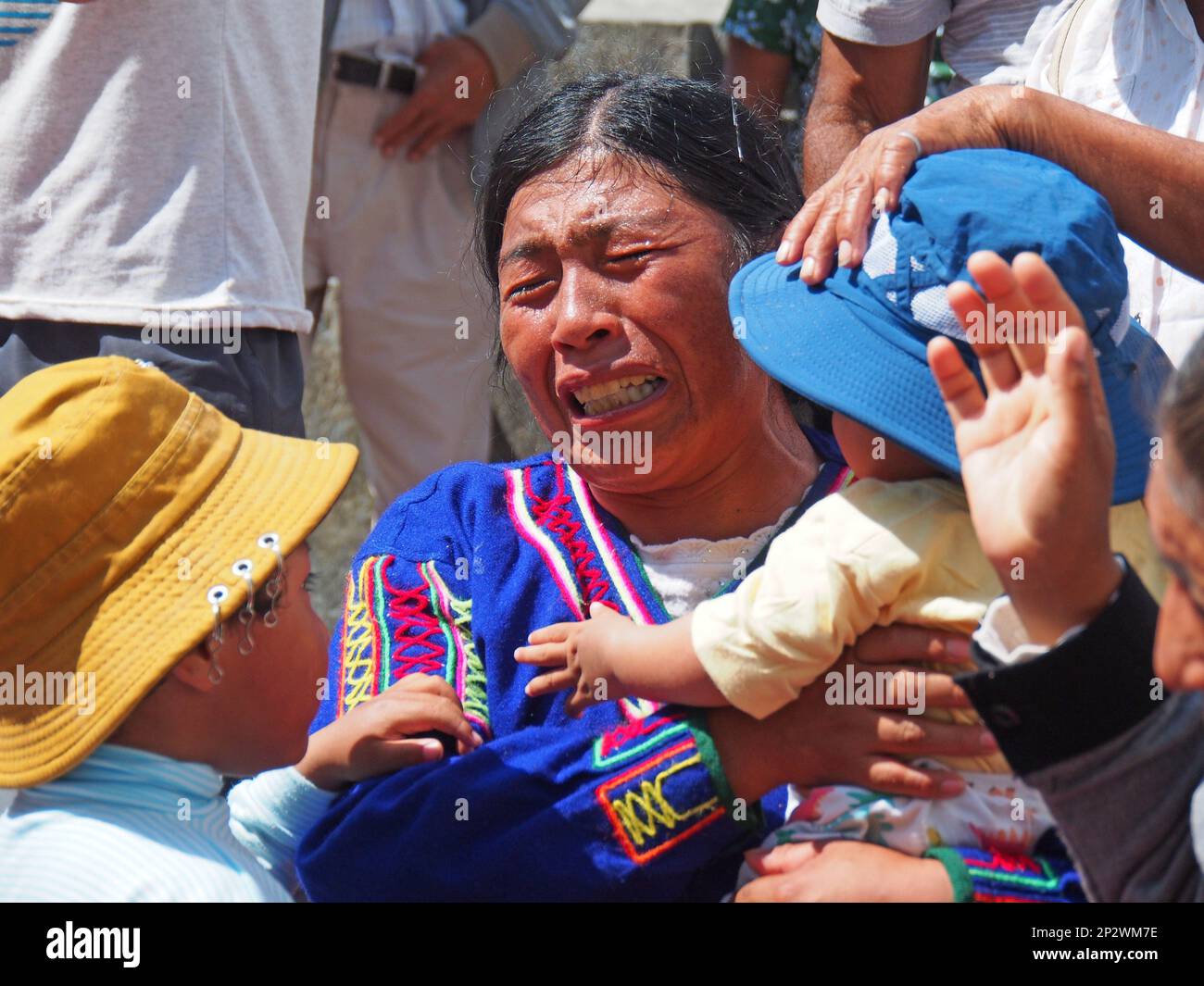 A woman crying when a group of indigenous women carry out a healing ...