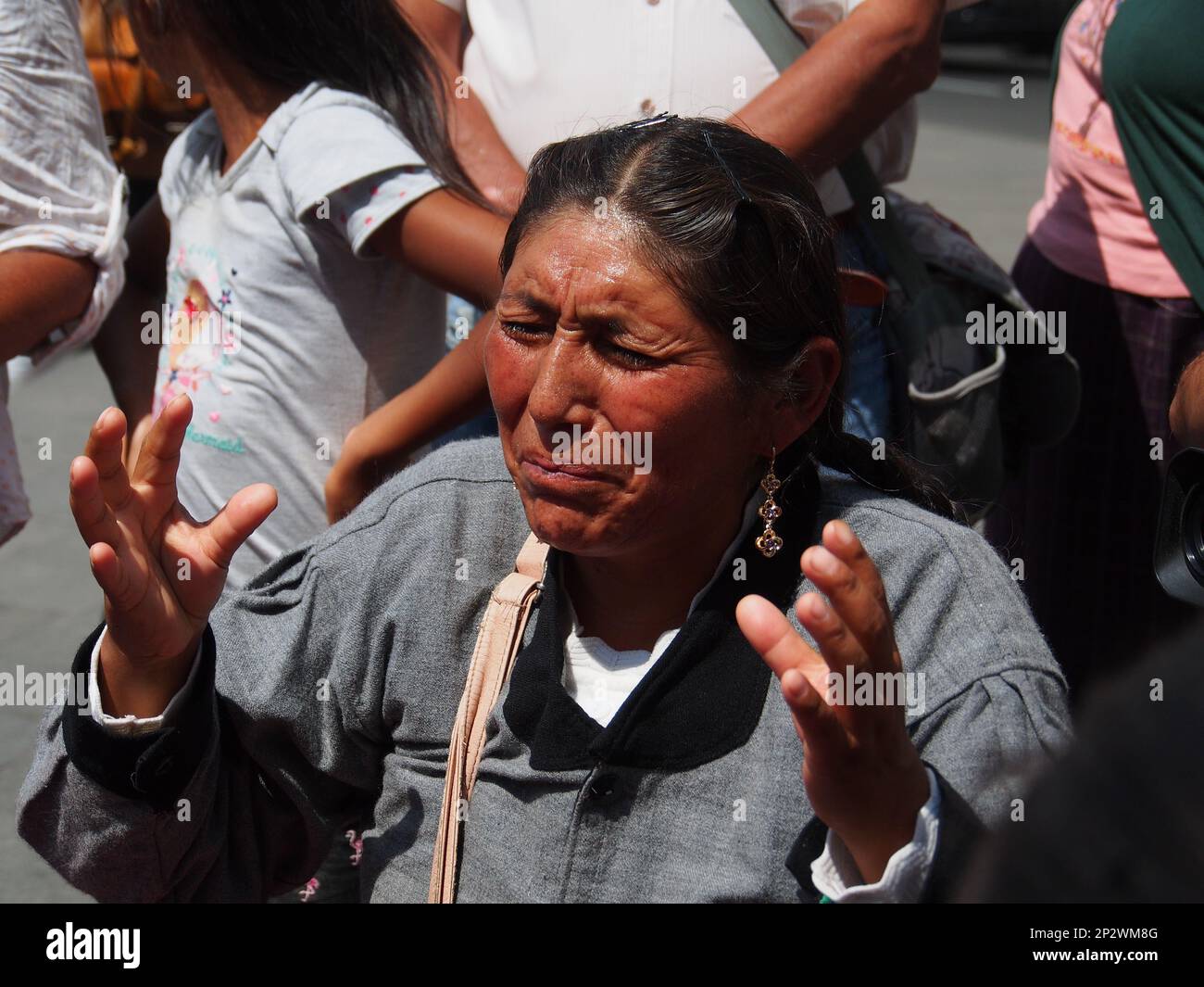 A woman crying when a group of indigenous women carry out a healing ...