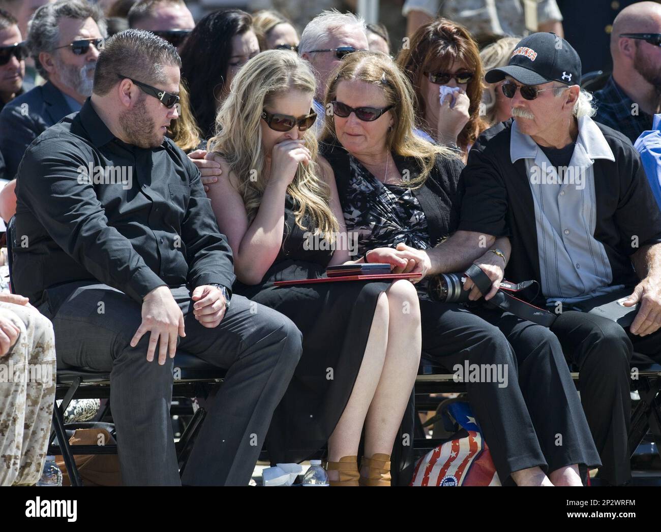 Samantha Seaman, second from left, wife of Sergeant Eric Seaman, is ...