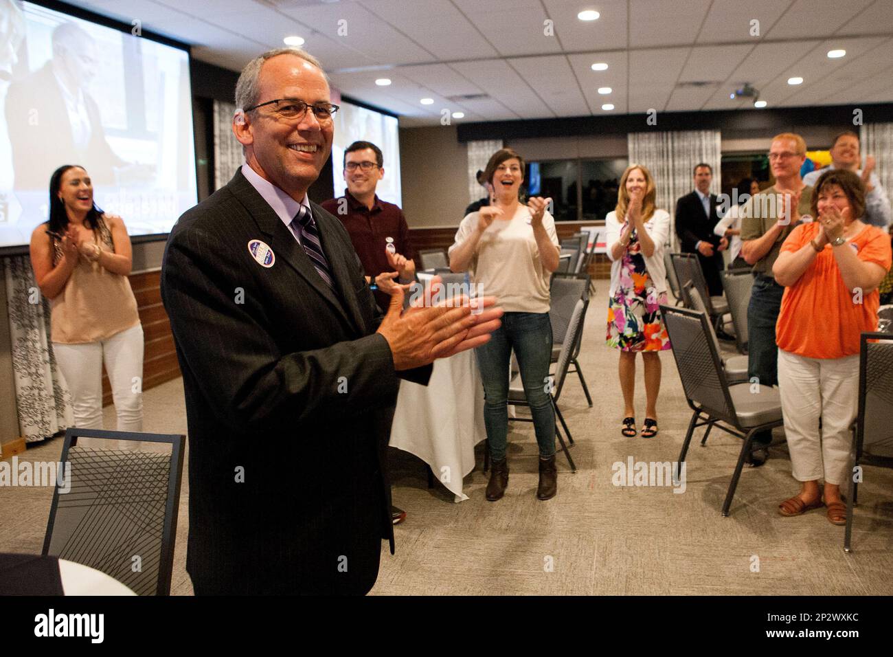 Retired Rapid City, S.D. police chief Steve Allender applauds with his ...