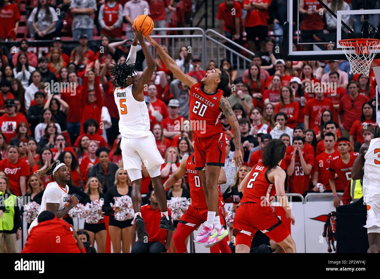 Oklahoma State's Caleb Asberry (5) passes the ball over Texas Tech's ...