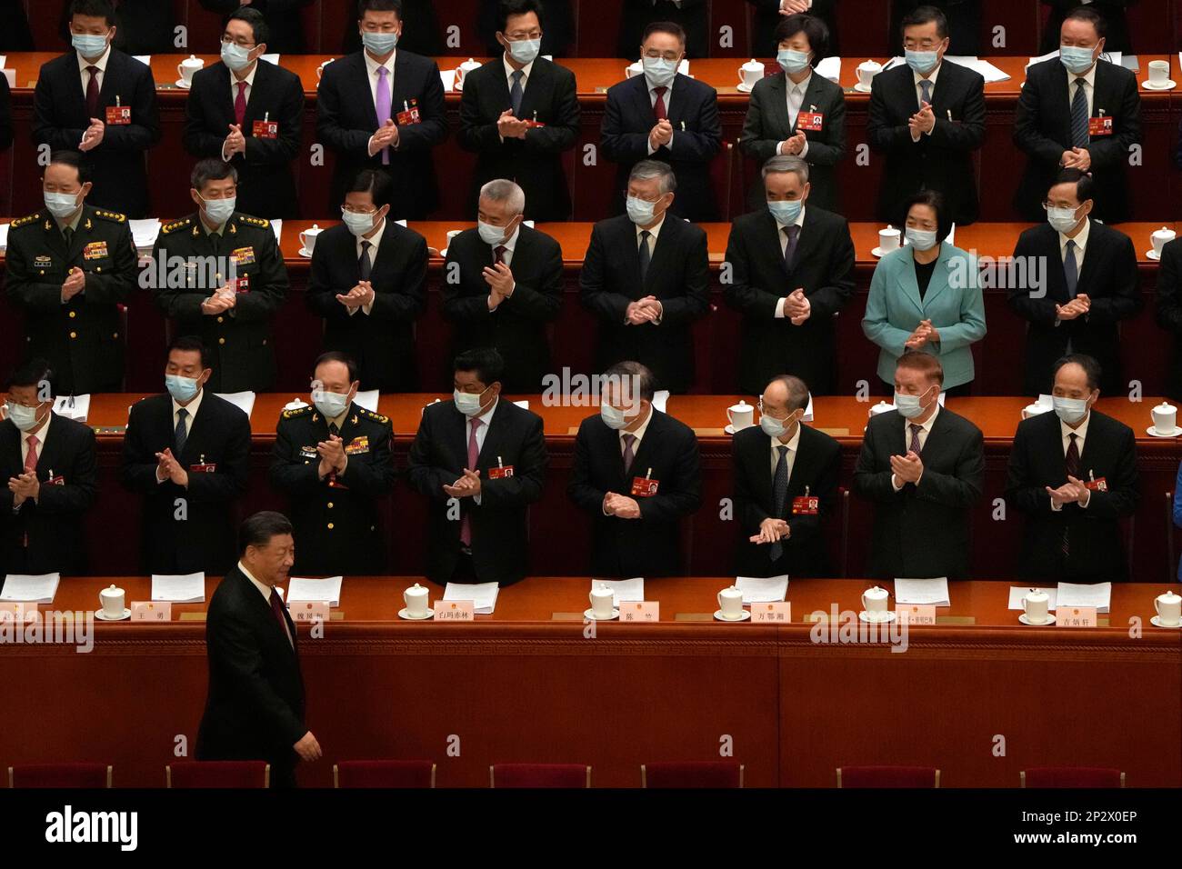 Delegates applaud as Chinese President Xi Jinping arrives for the ...