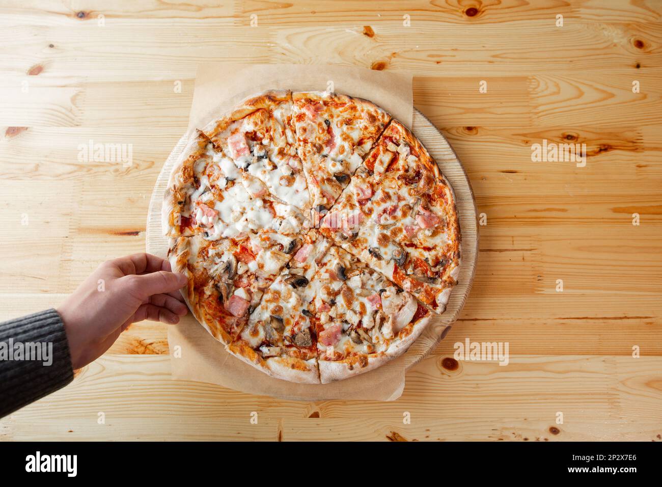 one people taking slices of pizza out of the box. fast delivery of food ...