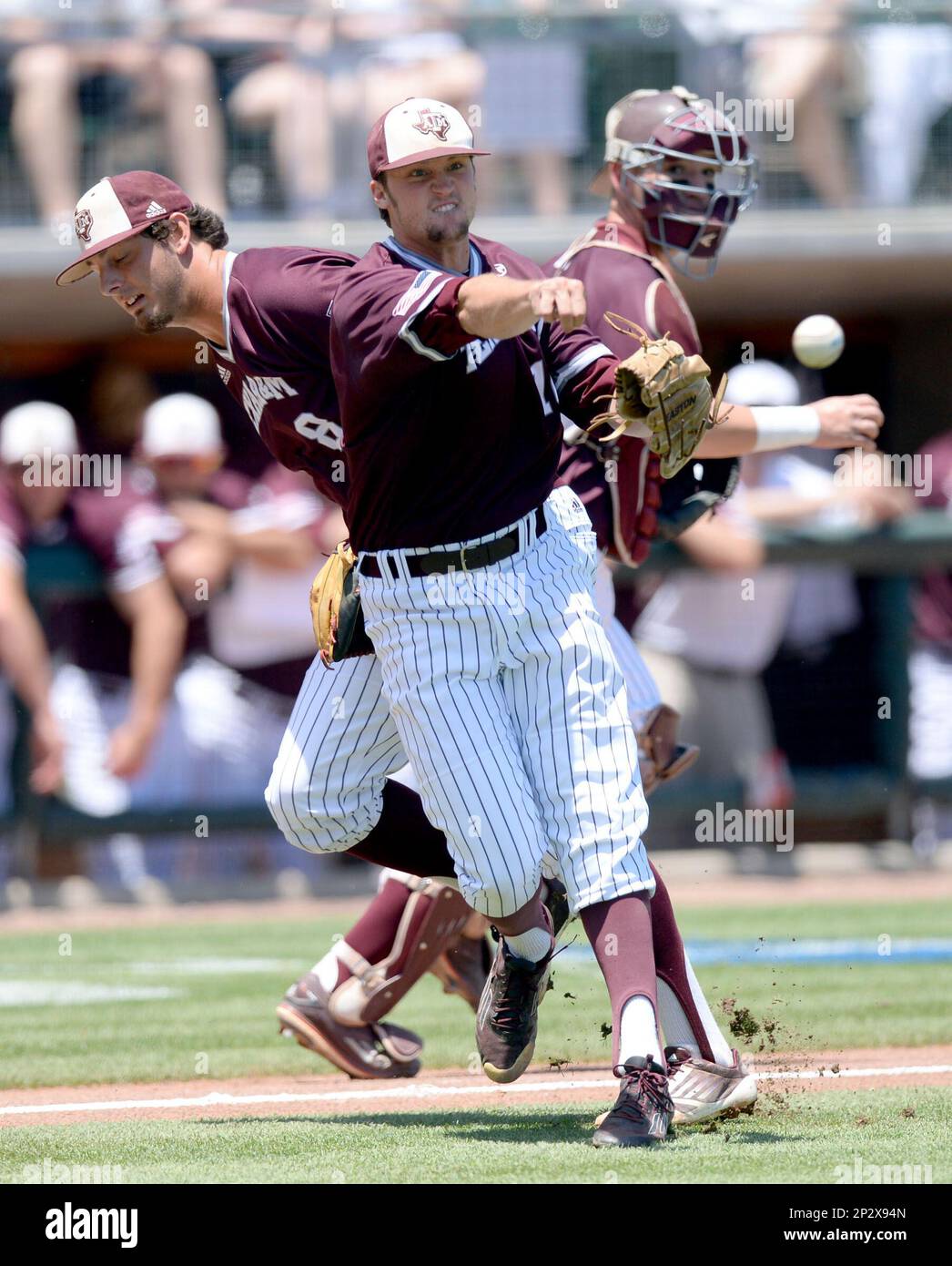 Texas A&M's Andrew Vinson (10) throws to first for an out against ...