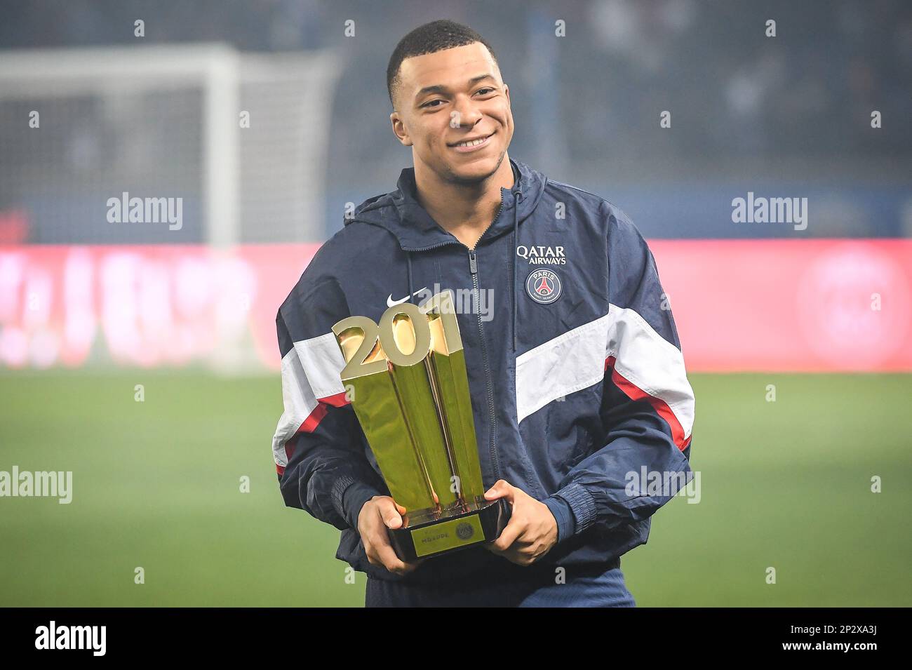 Kylian MBAPPE of PSG celebrates with a trophy after becoming Paris ...