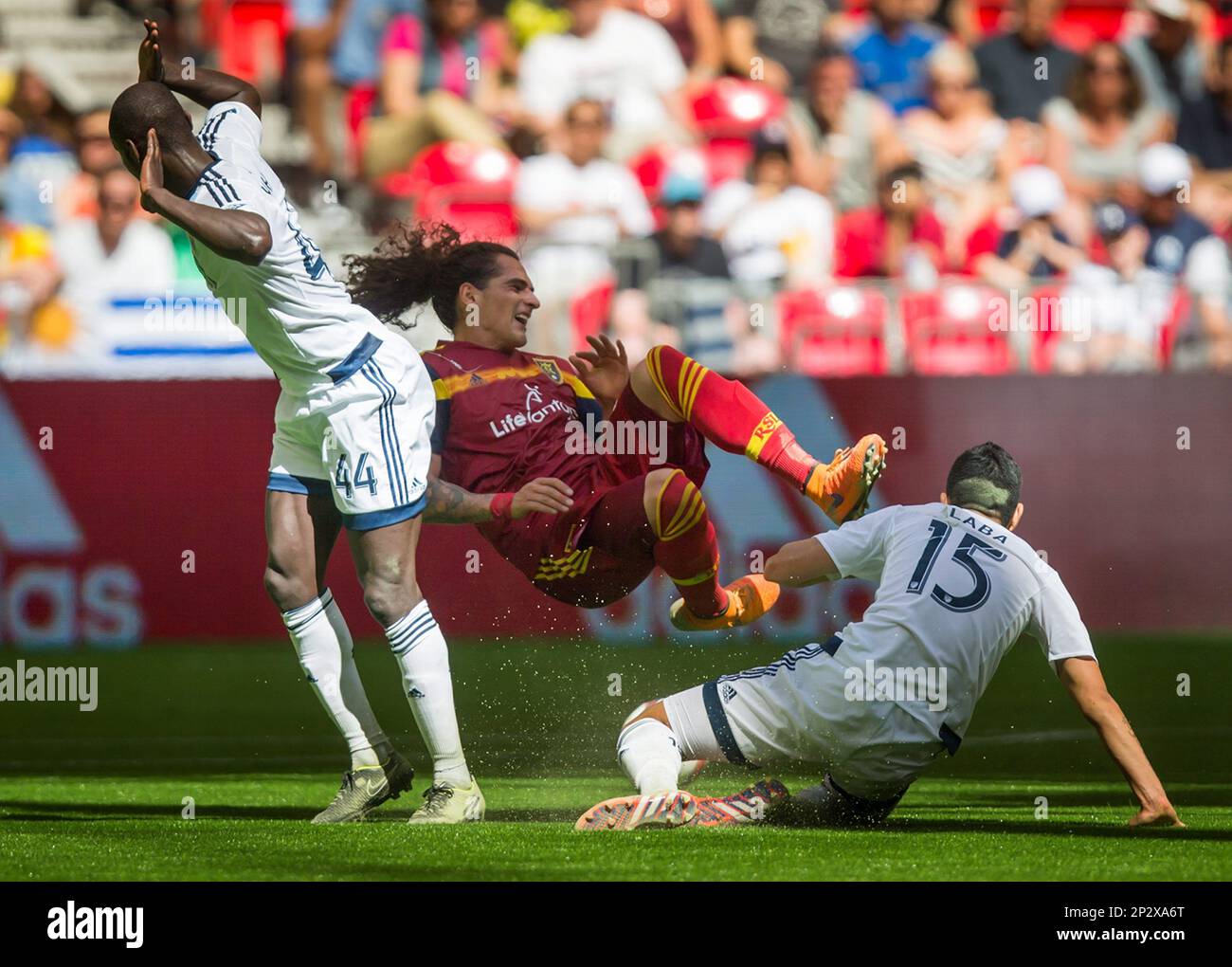 Real Salt Lake's Devon Sandoval, center, is upended during a collision ...
