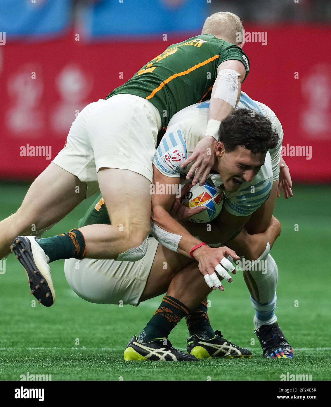 Argentina's Rodrigo Isgro, front right, is tackled by South Africa's ...