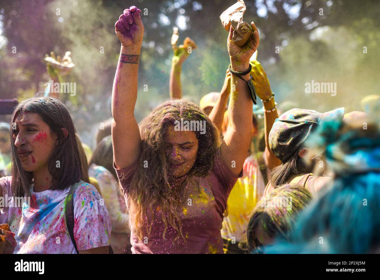 A reveler dances during the celebration of the Holi Festival. For the ...