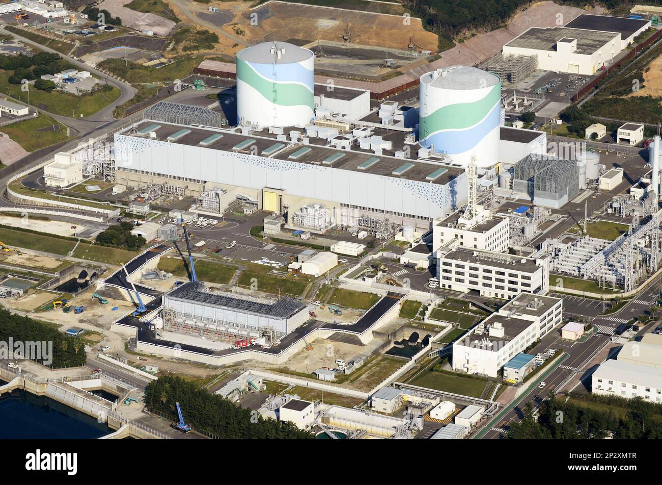 FILE - This Oct. 24, 2014 aerial photo shows two reactors at the Sendai ...