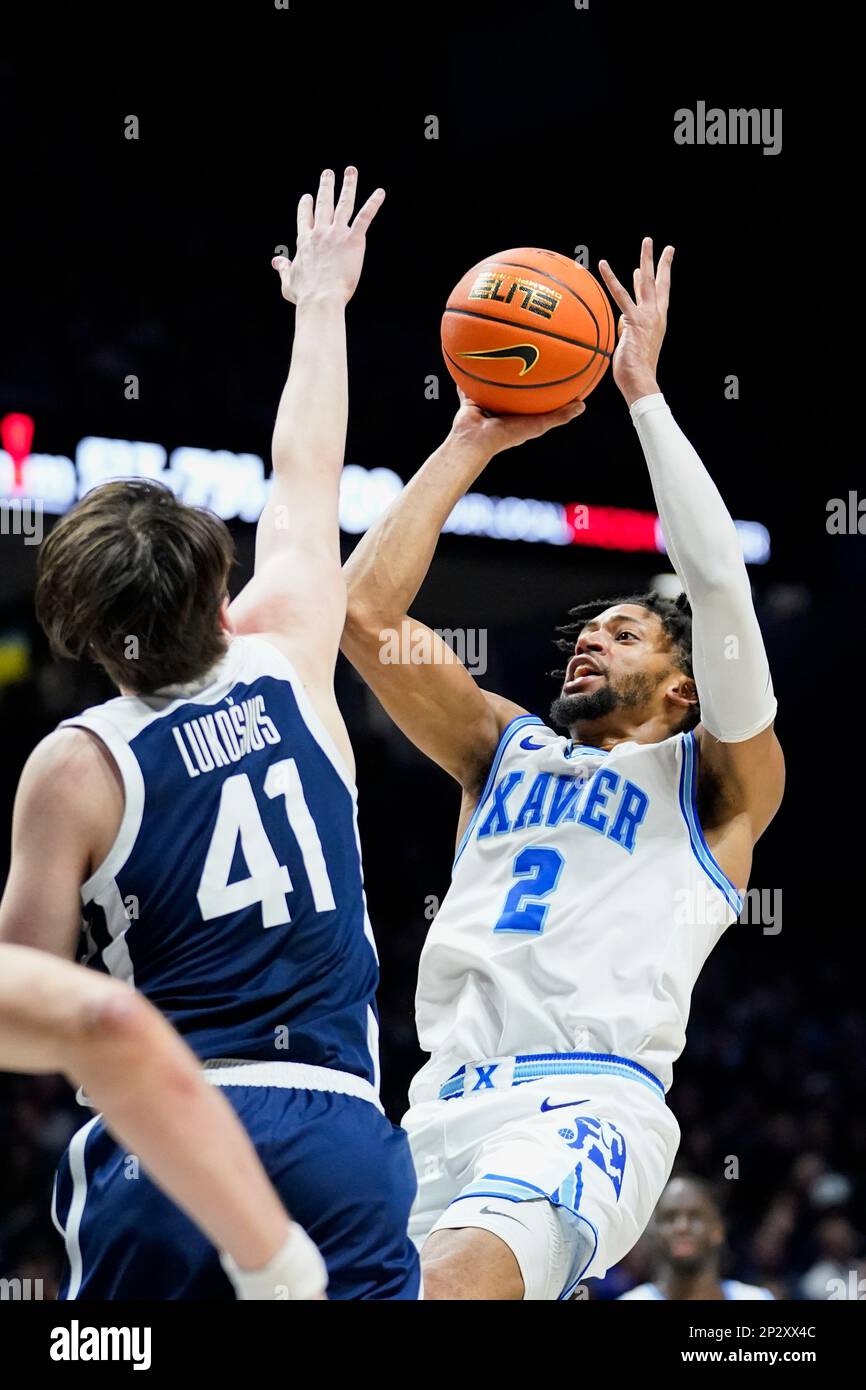 Xavier forward Jerome Hunter (2) shoots over Butler guard Simas ...