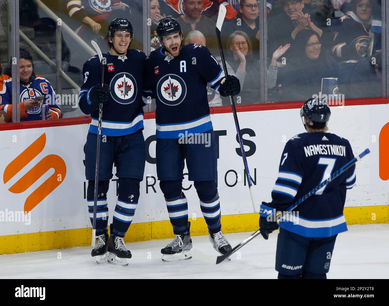 Winnipeg Jets' Morgan Barron and Adam Lowry celebrate Lowry's goal ...