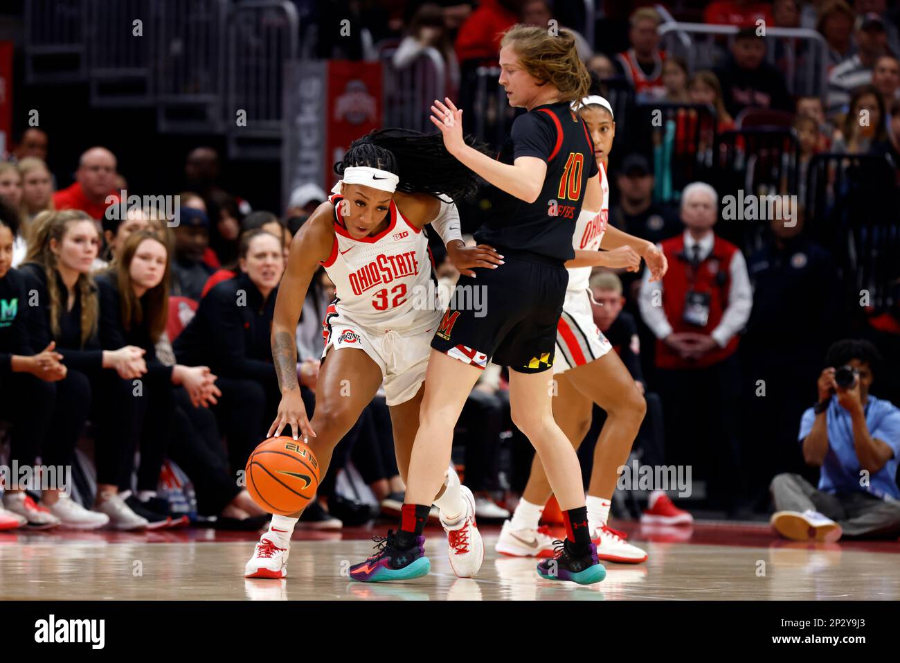 Ohio State forward Cotie McMahon, left, drives in front of Maryland ...