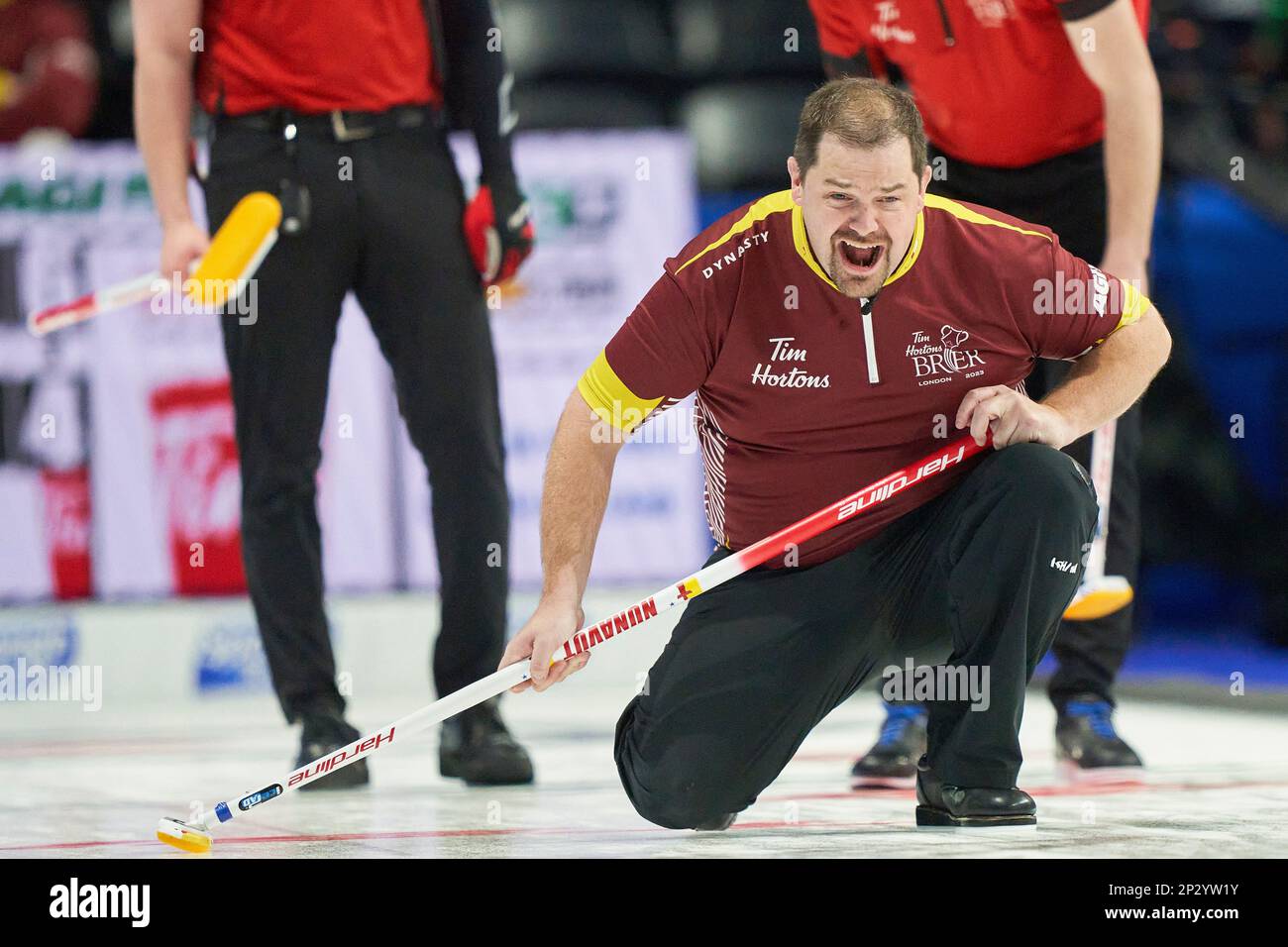 Nunavut skip Jake Higgs yells to his sweepers during the 10th end of ...