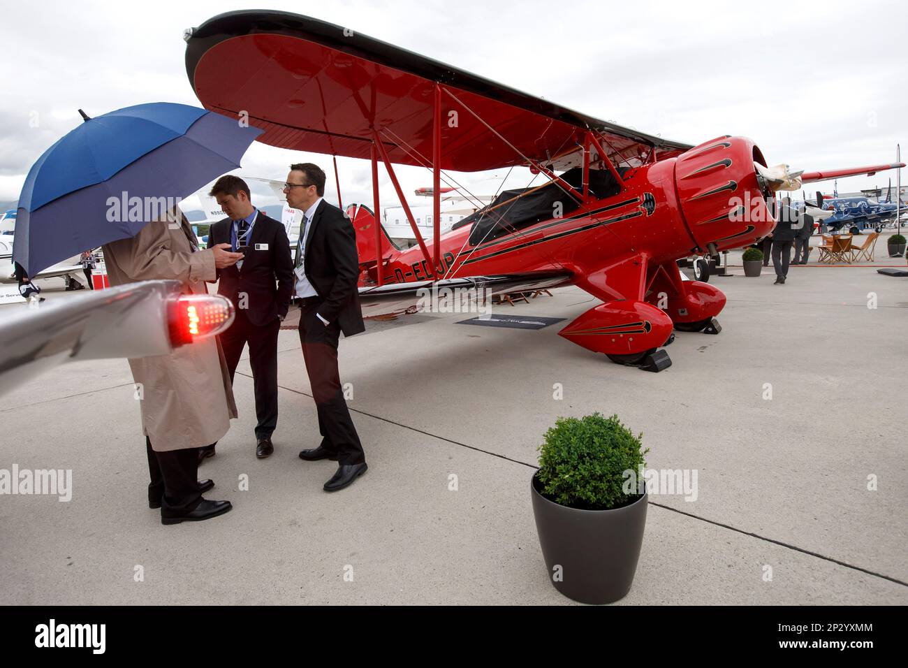 Visitors stand next to a WACO aircraft during the 15th Annual European ...