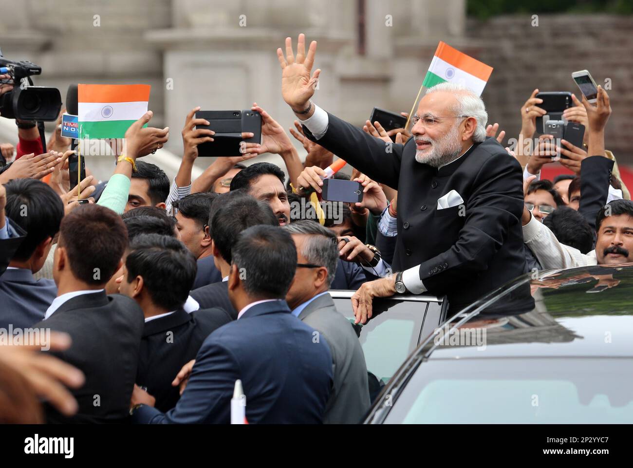 Indian Prime Minister Narendra Modi waves as he arrives to attend a ...