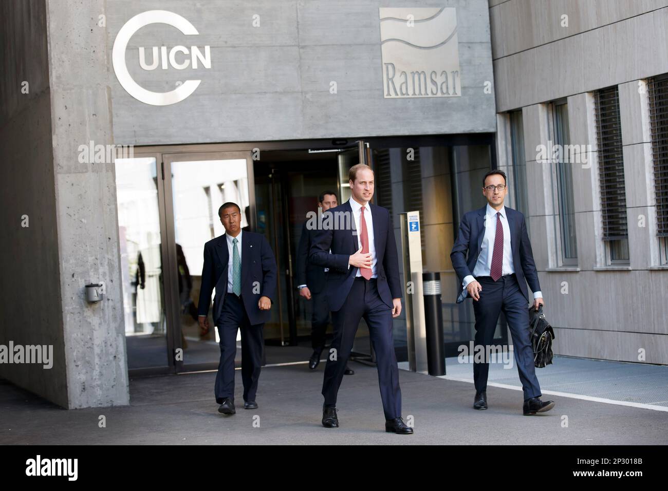 Prince William, center, the Duke of Cambridge, leaves the building ...
