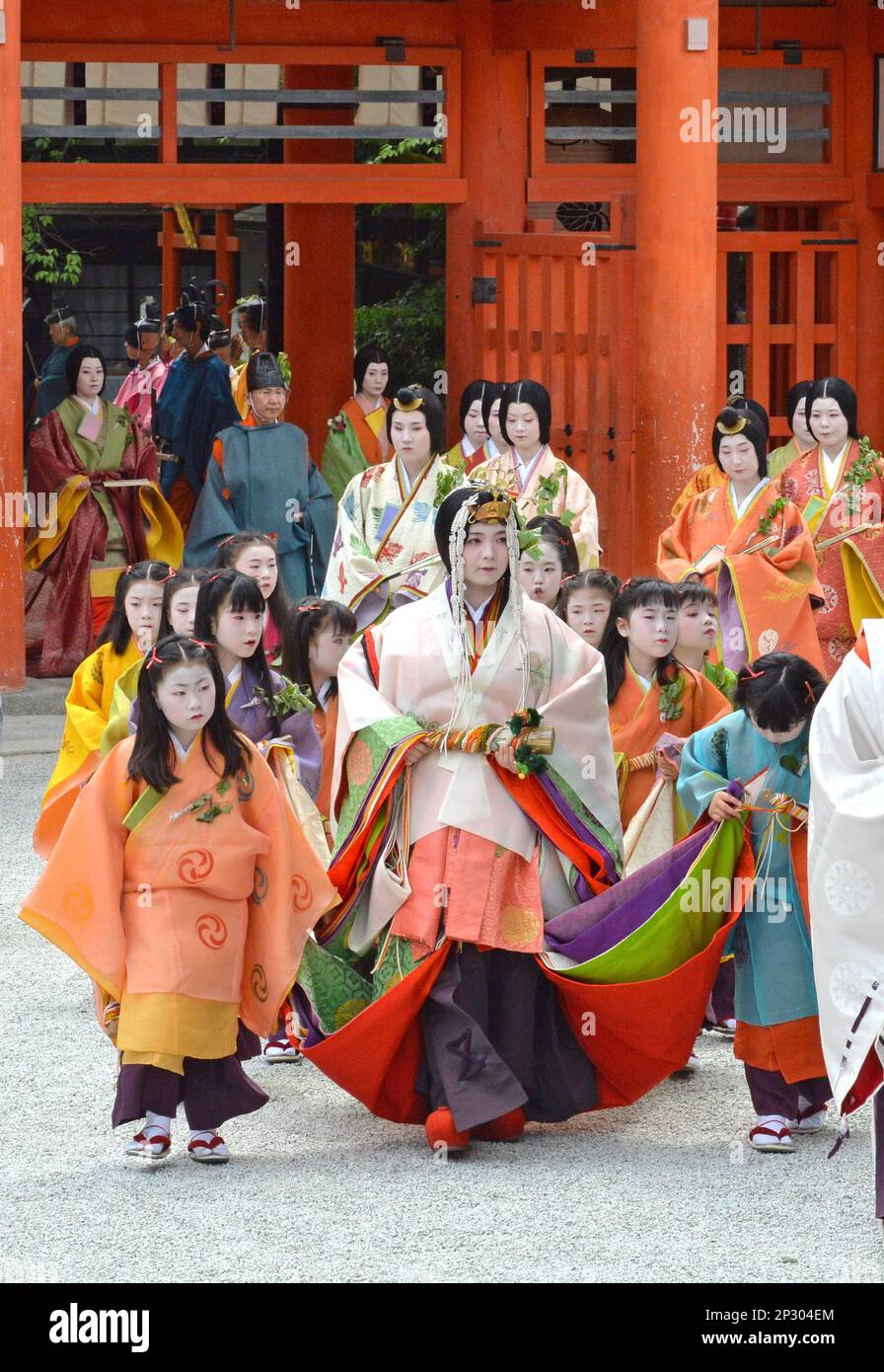 Acting High priestess (C) and followers dressed as court ladies of the ...