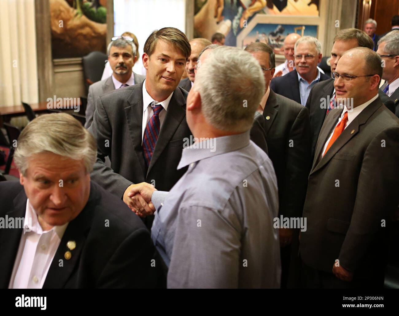 Todd Richardson, center, receives congratulatory handshakes from other ...