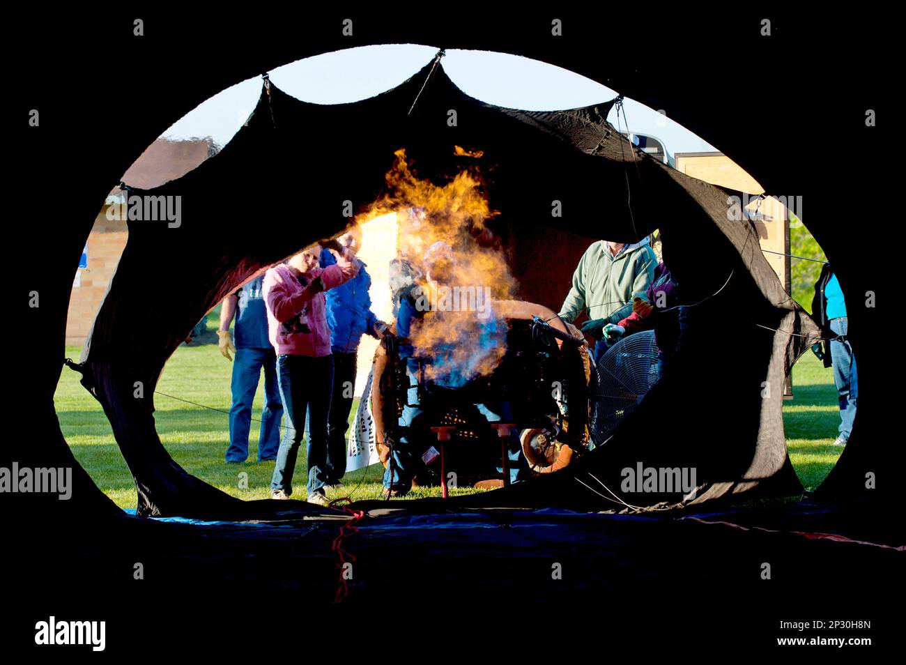 Walla Walla, Wash., Mayor Jerry Cummins, obscured behind the flames ...