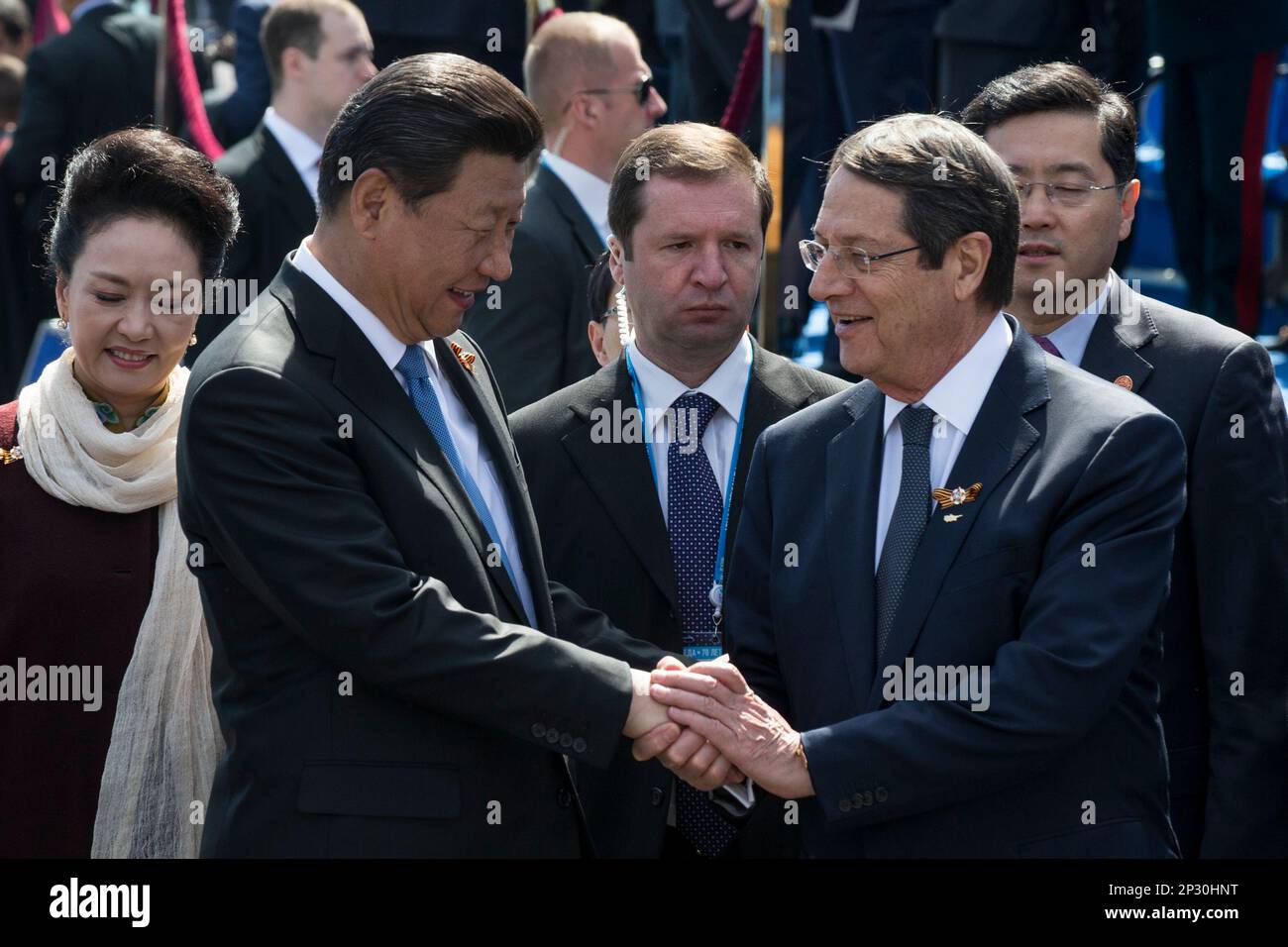 Cypriot President Nicos Anastasiades, right, shakes hands with Chinese ...