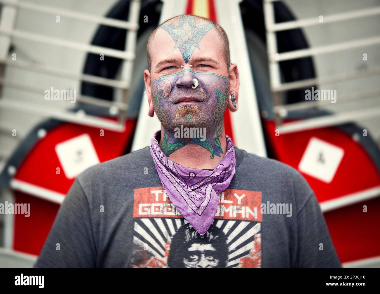 Ride operator Allan Ross of Missoula takes a break from setting up ...