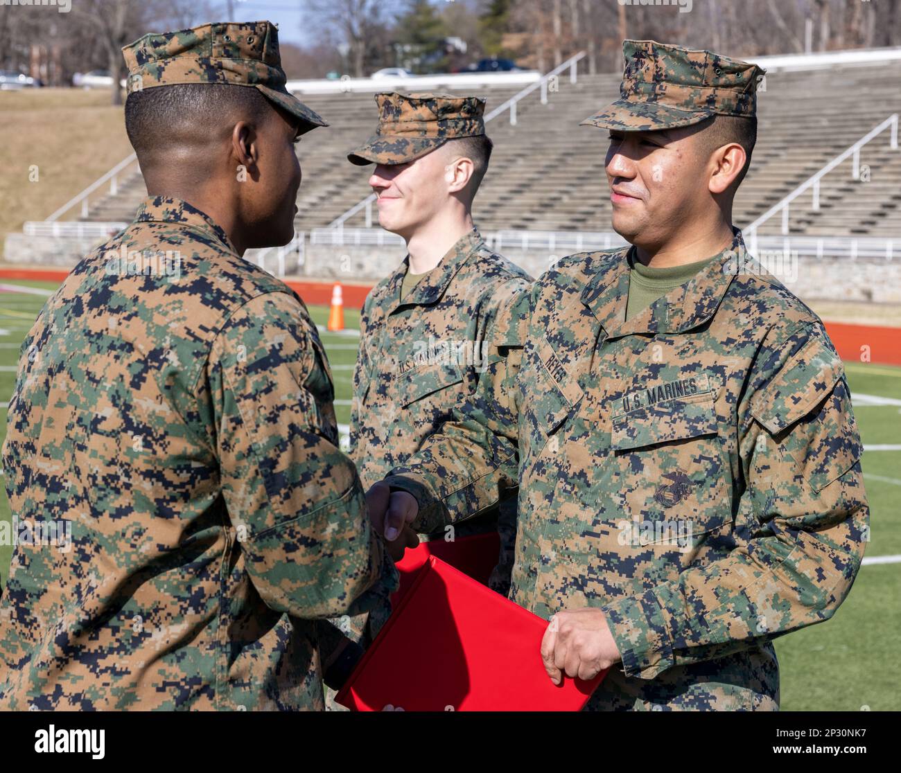 U.S. Marine Corps Pfc. Erick Reyes, a combat graphics specialist, right ...