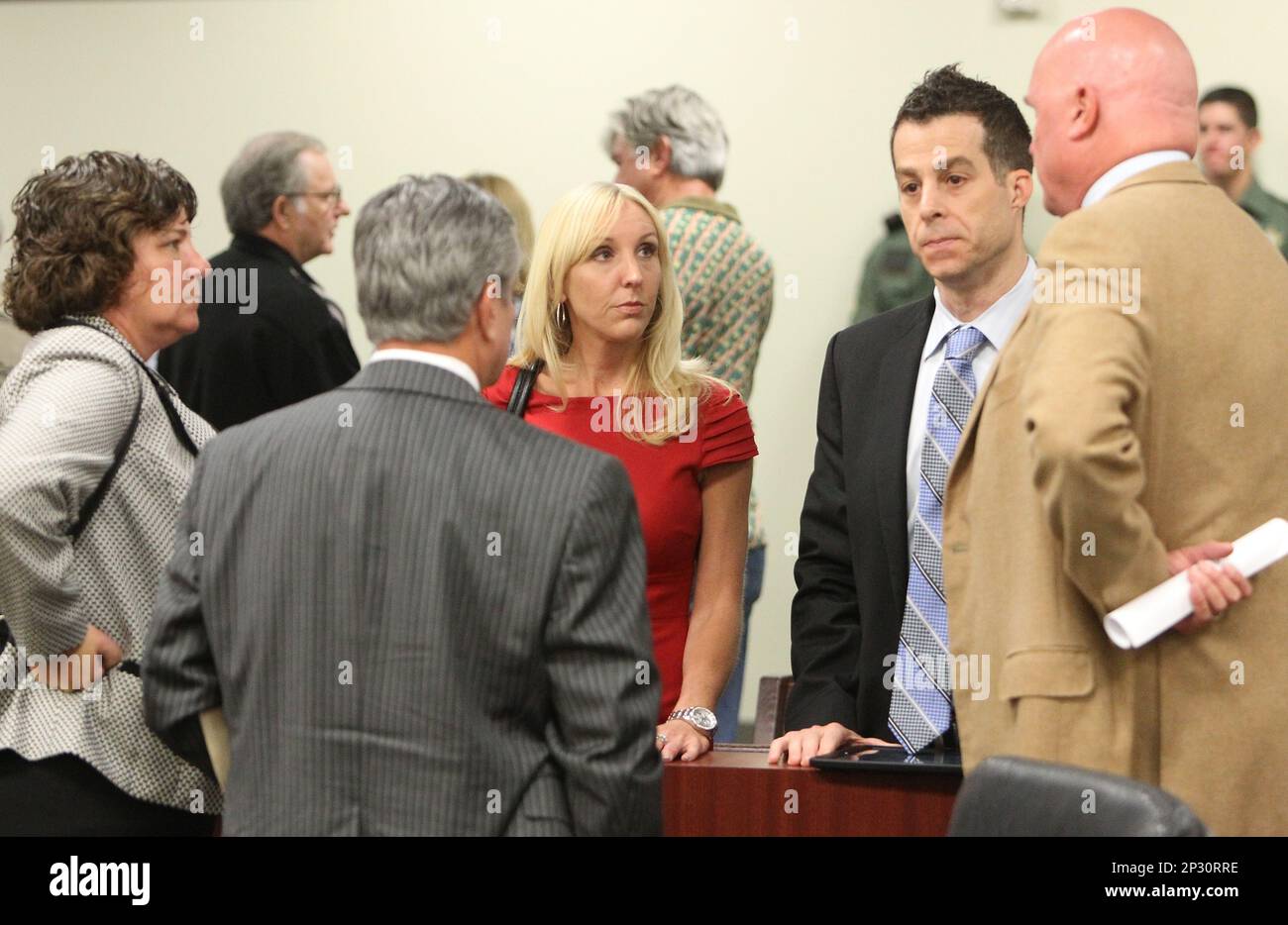 Theater shooting victim Nicole Oulson, center, and her attorney TJ ...