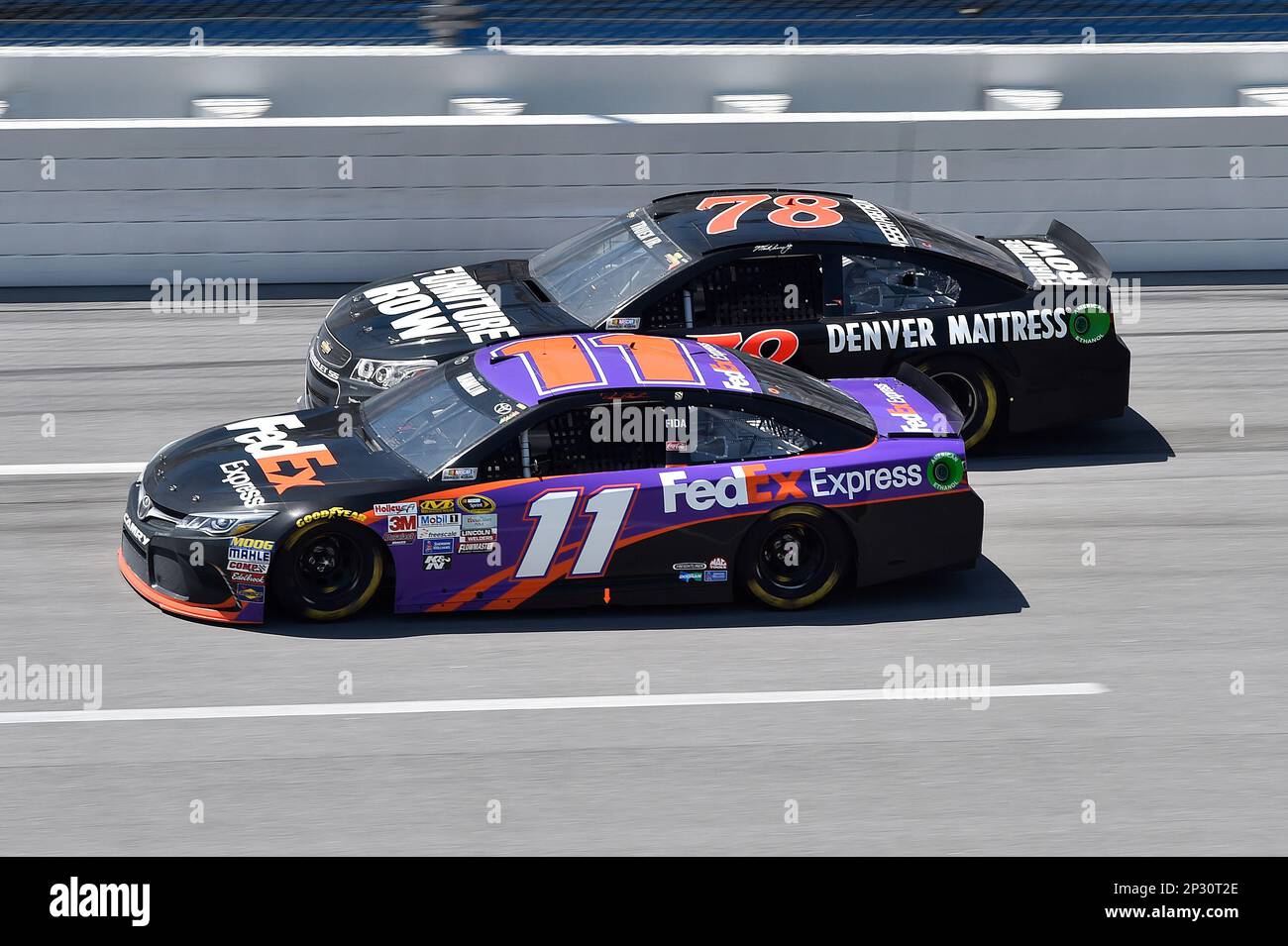 Denny Hamlin, FedEx Express Toyota Camry (11) races with Martin Truex ...