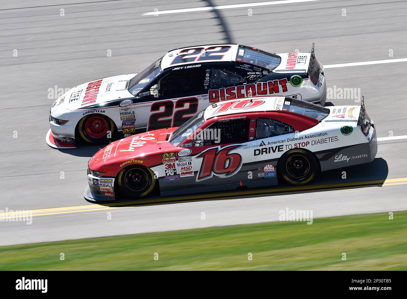 Joey Logano (22) races with Ryan Reed (16) during the NASCAR Xfinity ...