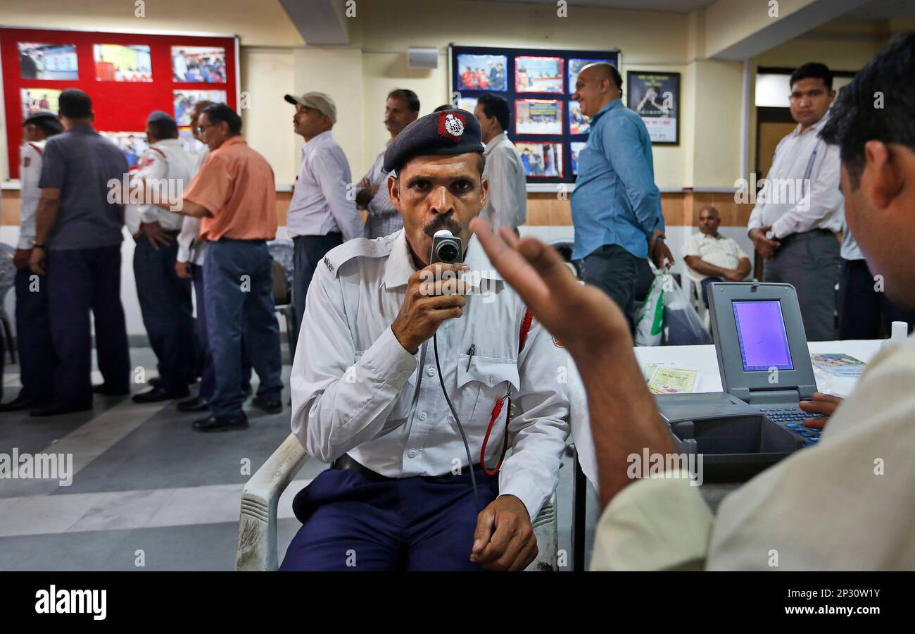 A Delhi Traffic Police constable undergoes a spirometry test to help ...