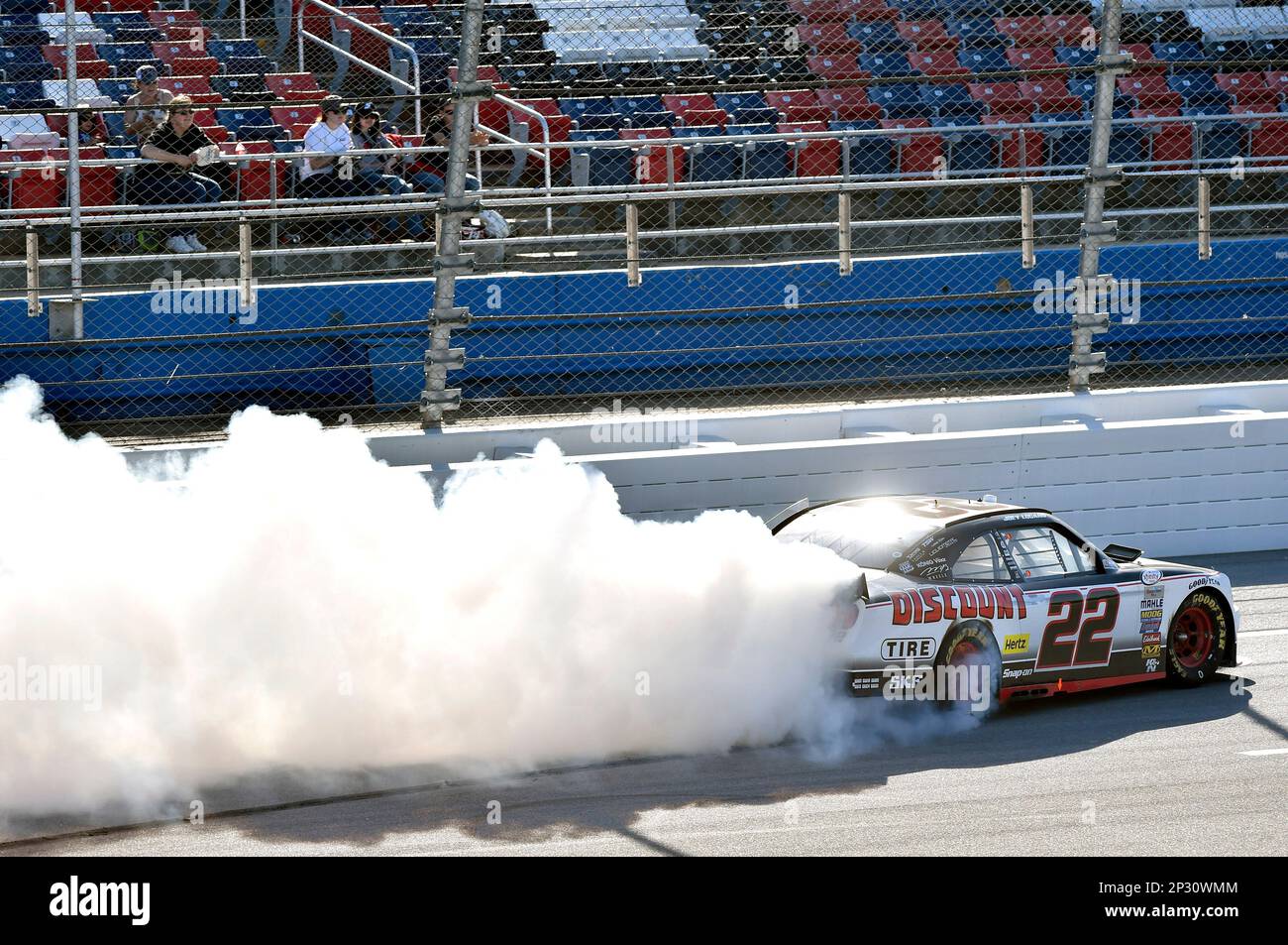 Joey Logano celebrates his win with a burnout during the NASCAR ...