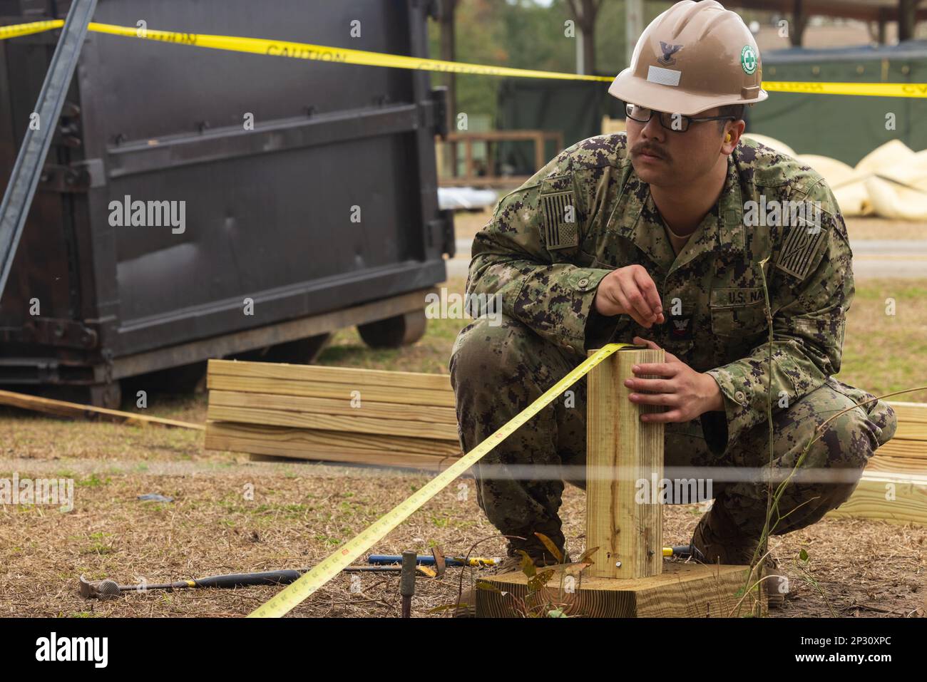 U.S. Navy Steelworker 2nd Class Jiajun Wu with Naval Mobile ...