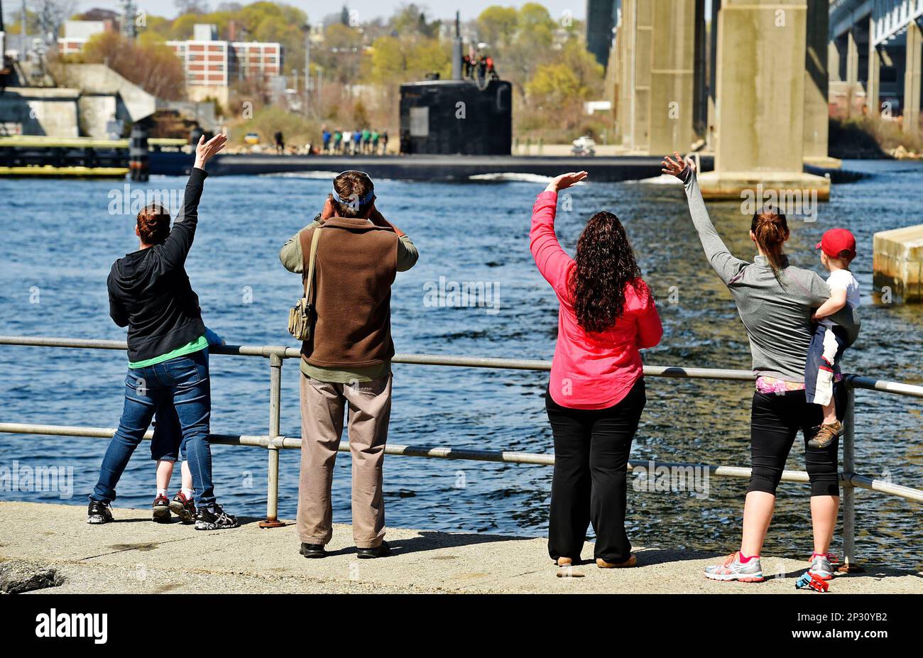 Family members wave to the crew of the U.S. Navy Los Angeles Class ...