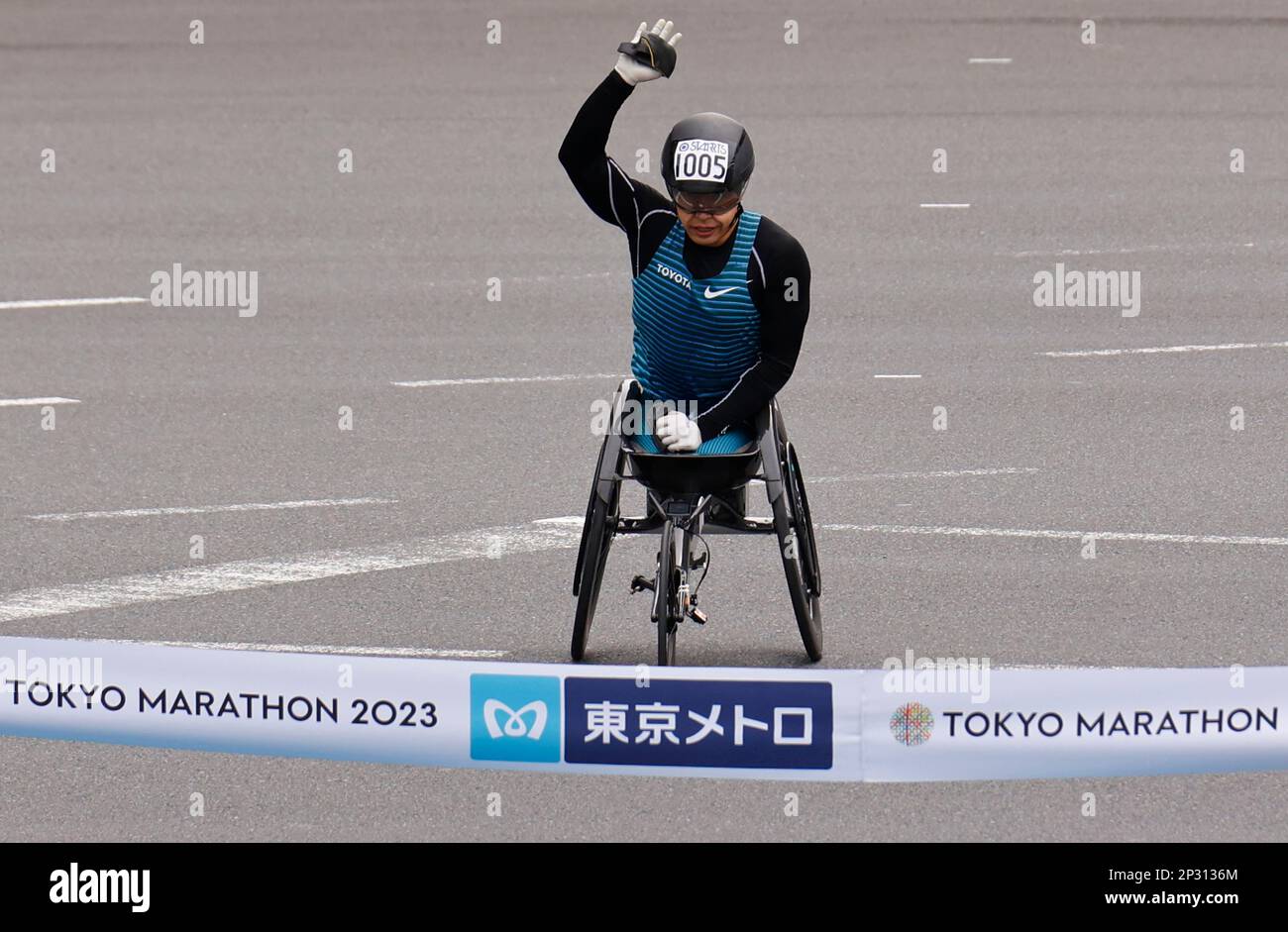 Tomoki Suzuki of Japan reacts to finish in the second place of the men's wheelchair race of the ...