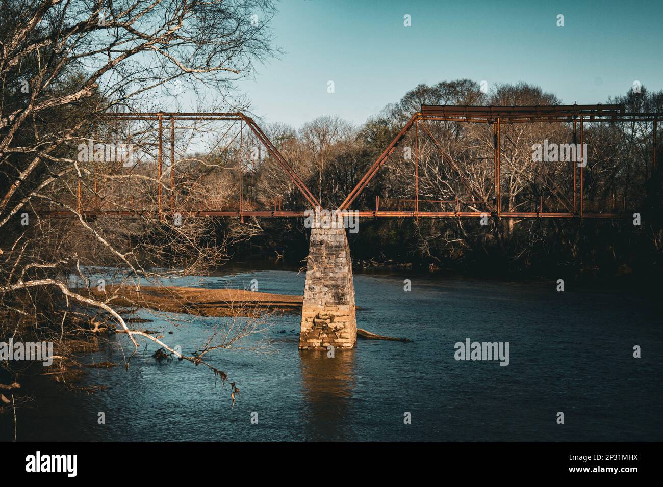 Dowhait's Bridge, a rusted old train and car bridge with a river ...