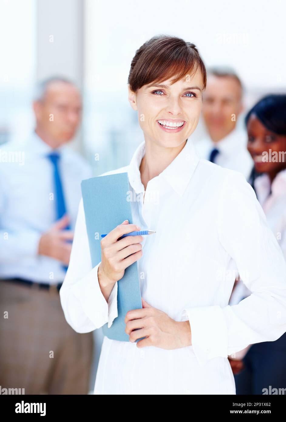 Female executive representing team. Female executive posing with ...