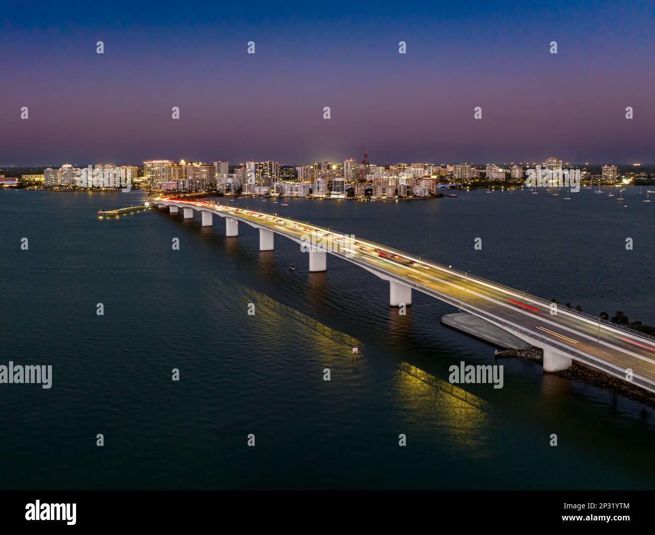 Evening aerial image of the Sarasota, Florida Skyline and Bridge Across ...