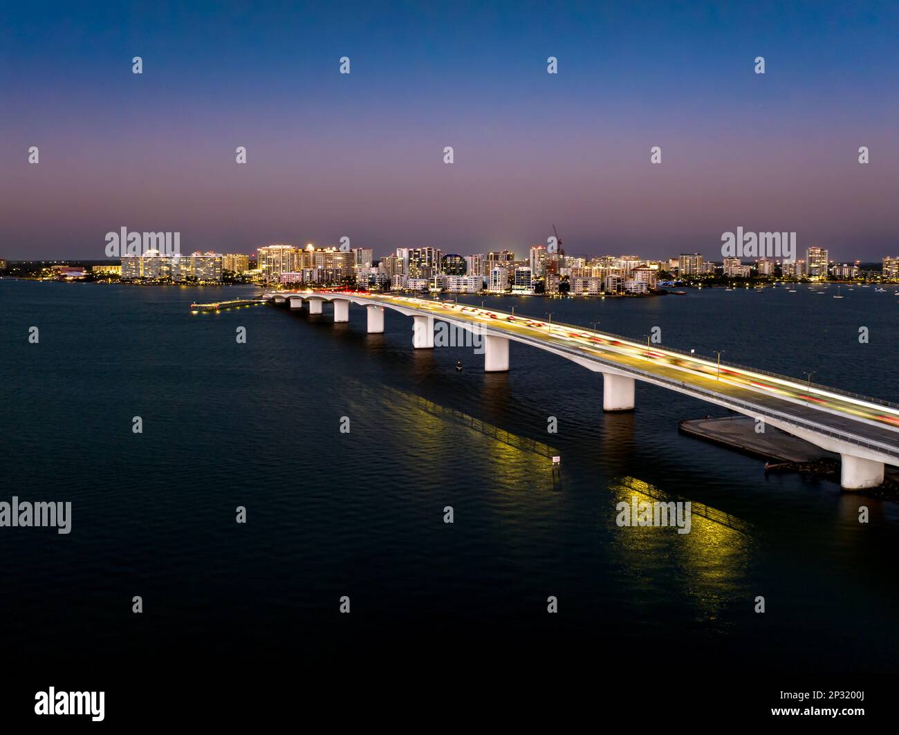 Evening aerial image of the Sarasota, Florida Skyline and Bridge Across ...